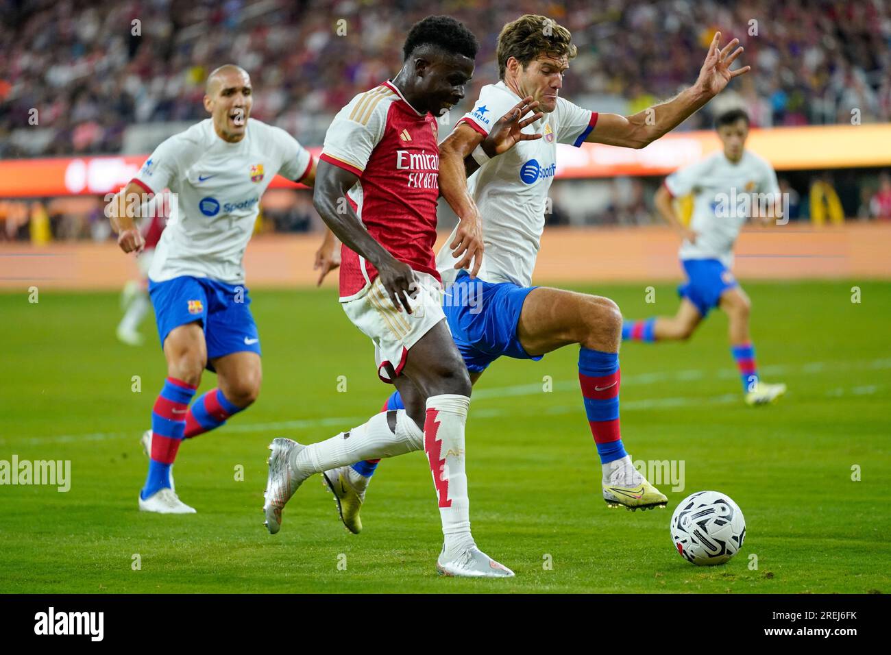 Arsenal FC midfielder Bukayo Saka, center, and FC Barcelona forward ...