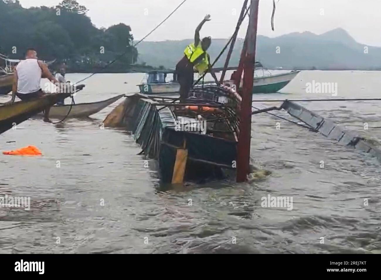 In this image from video provided by the Philippine Coast Guard, a man ...