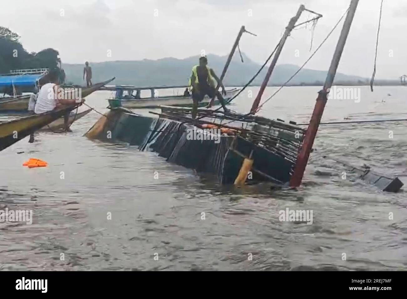 In this image from video provided by the Philippine Coast Guard, a man ...