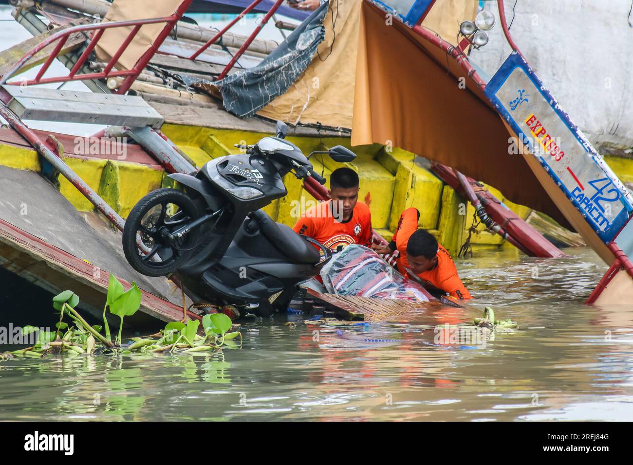Binangonan, Philippines. 28th July, 2023. A resident nearby watches the ...