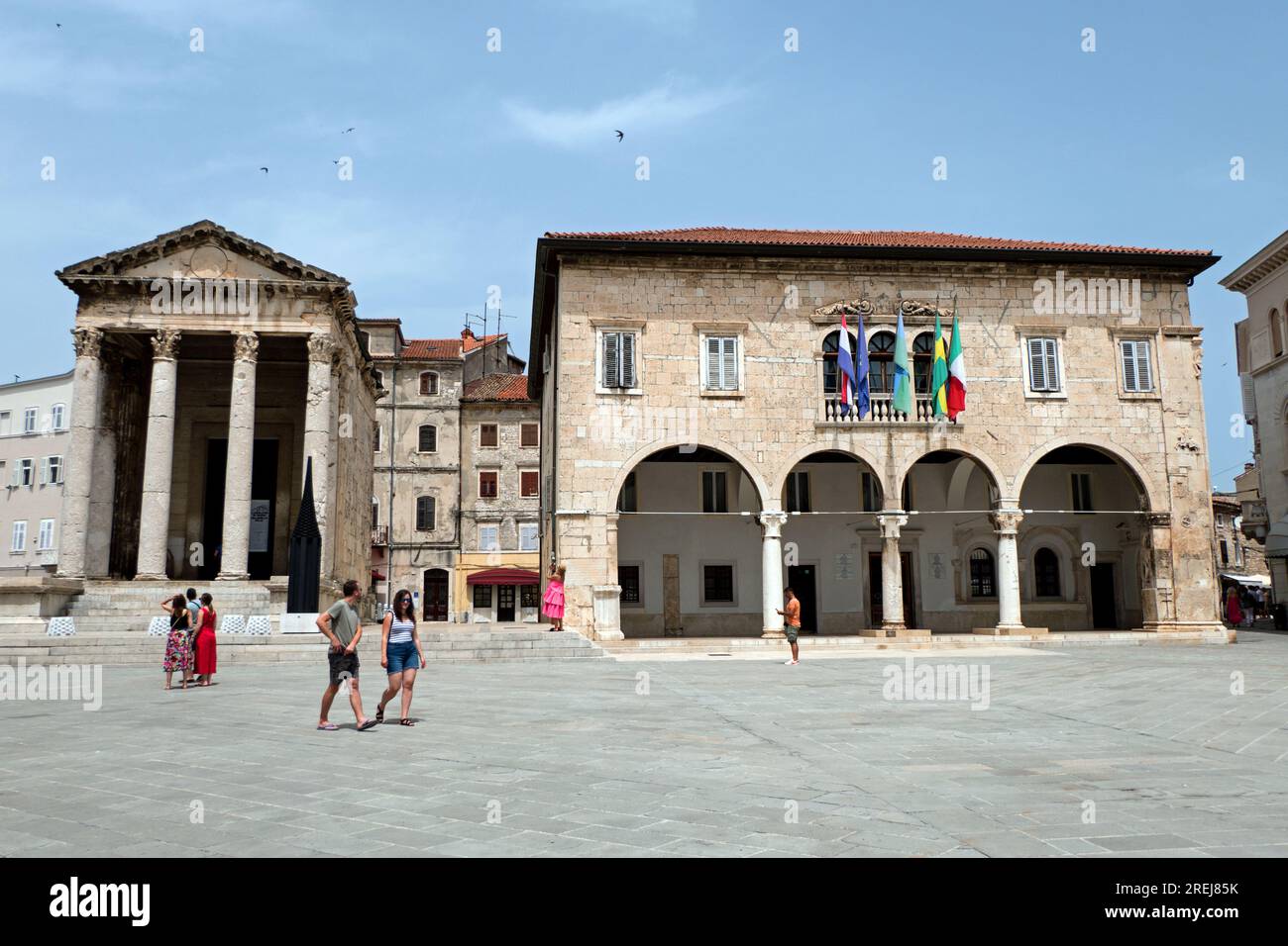 View of Pula (Pola) in Croatia with people and landmarks: Temple of ...