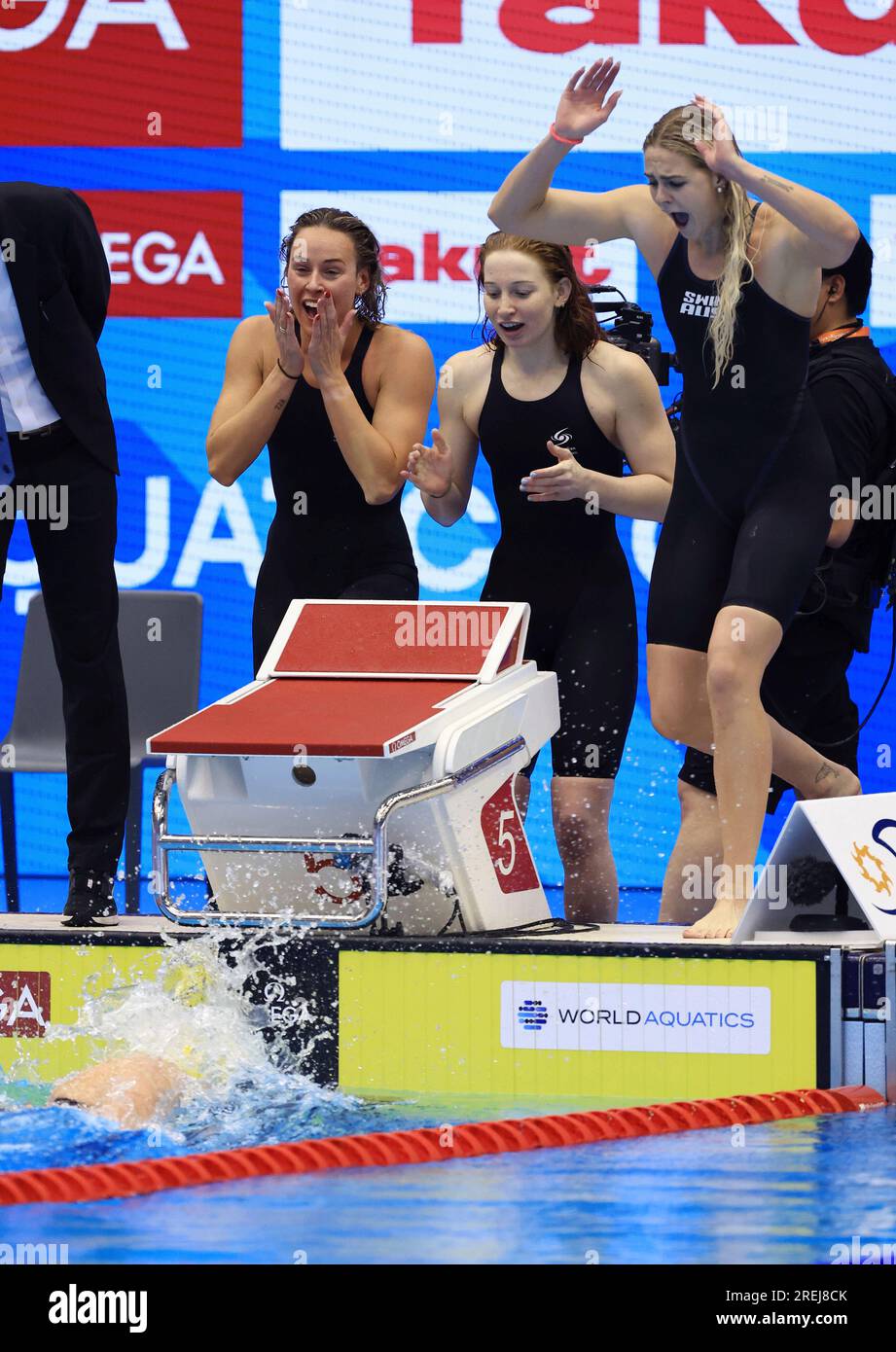 Members of Australia react during women's 4x200m freestyle relay final of World Aquatics ...
