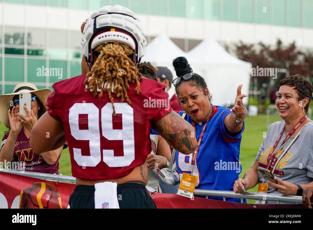 Washington Commanders defensive end Chase Young (99) walks to greet his ...