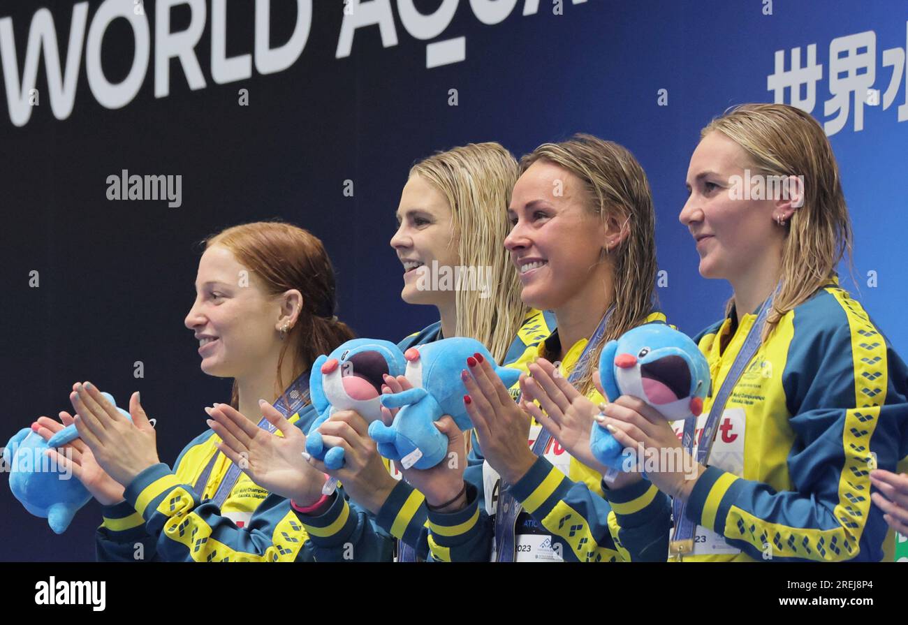 Members of Australia, winner, celebrate during an award ceremony of women's 4x200m freestyle ...