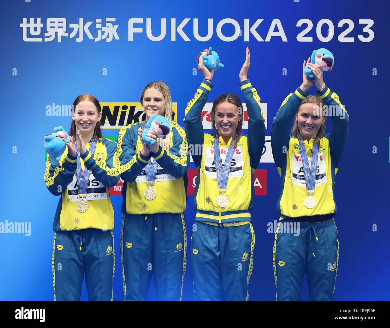 Members of Australia, winner, celebrate during an award ceremony of women's 4x200m freestyle ...
