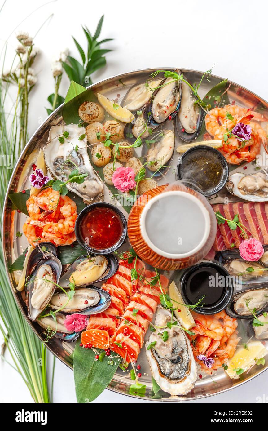 Fresh seafood plate with, mussels, oysters, scallop, salmon and tuna ...