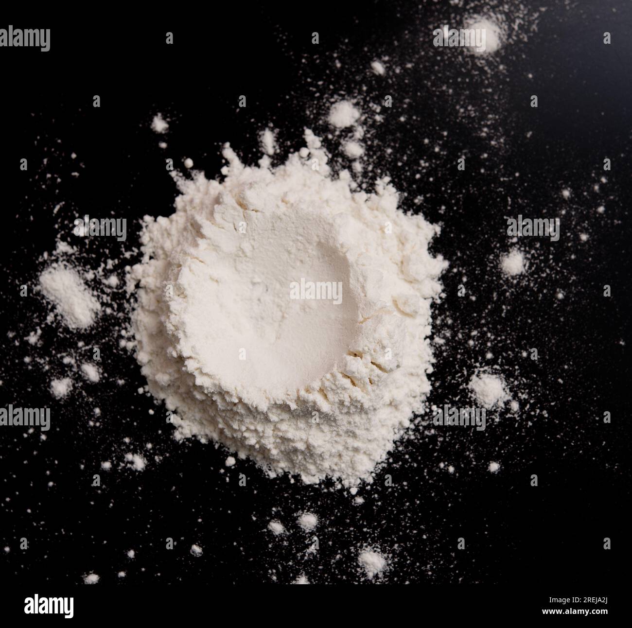 Wheat flour on black background Stock Photo - Alamy