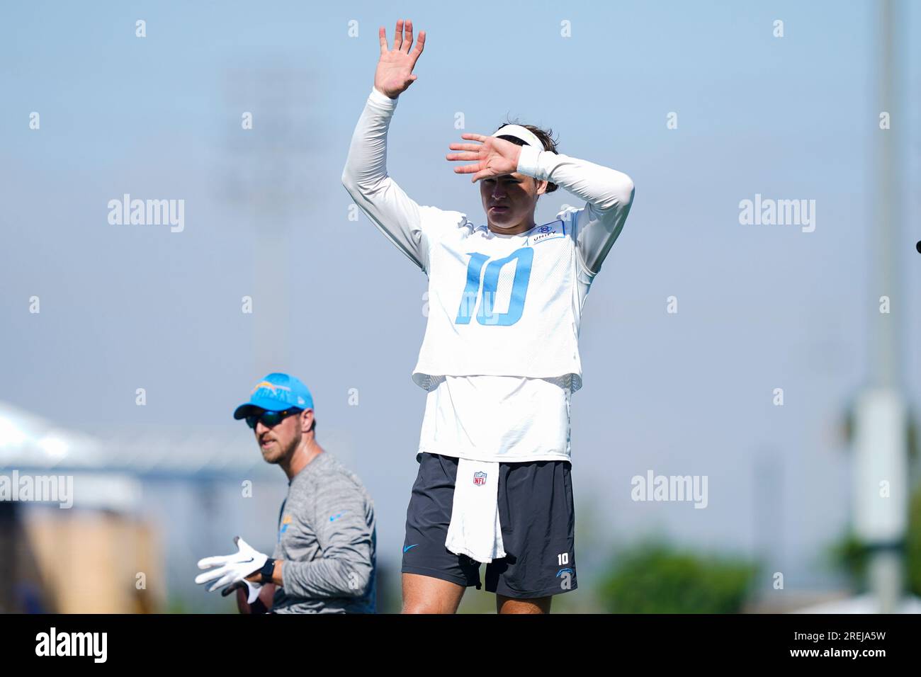 Los Angeles Chargers quarterback Justin Herbert shields his face from ...