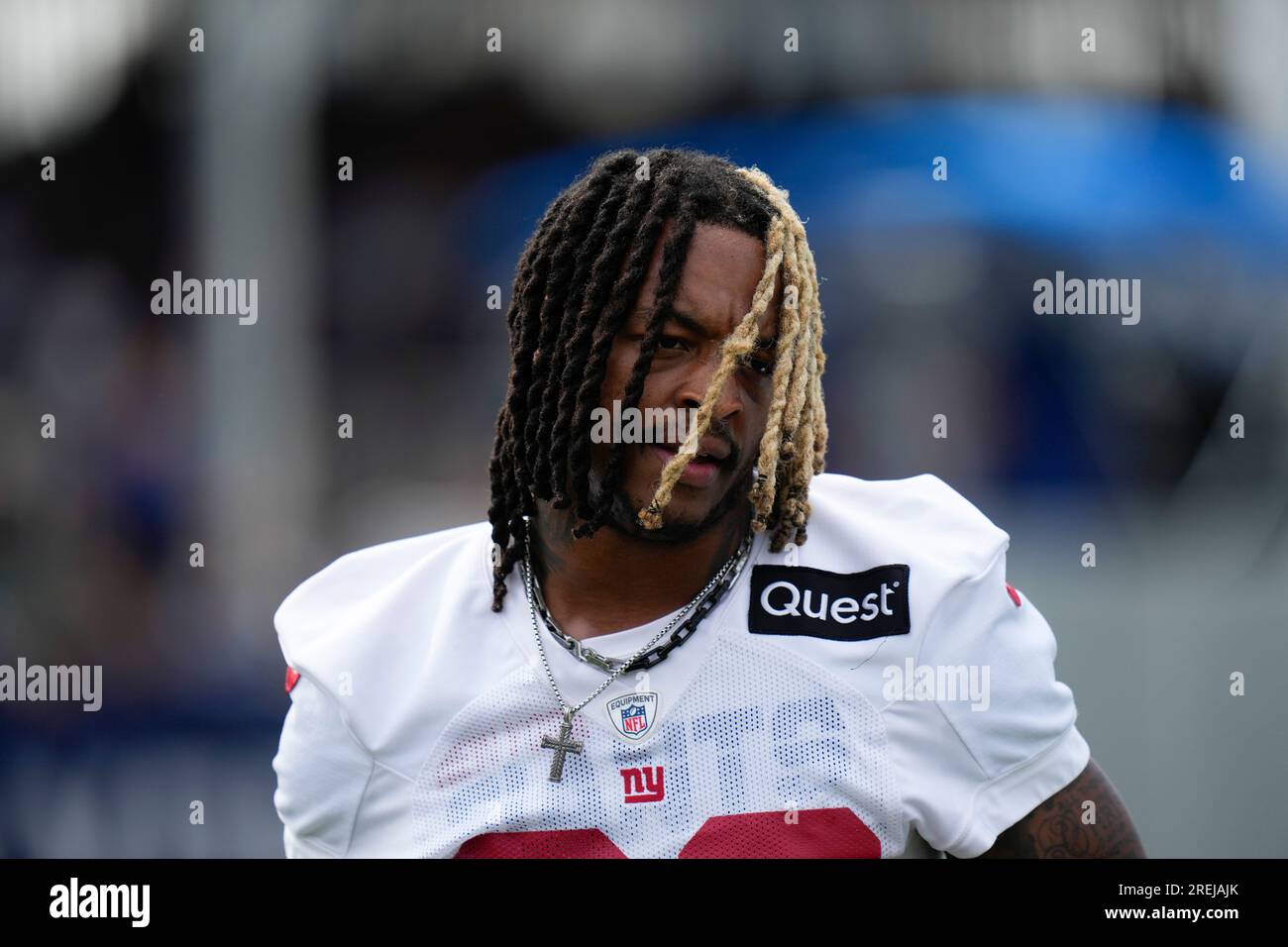 New York Giants' Xavier McKinney stretches at the NFL football team's ...