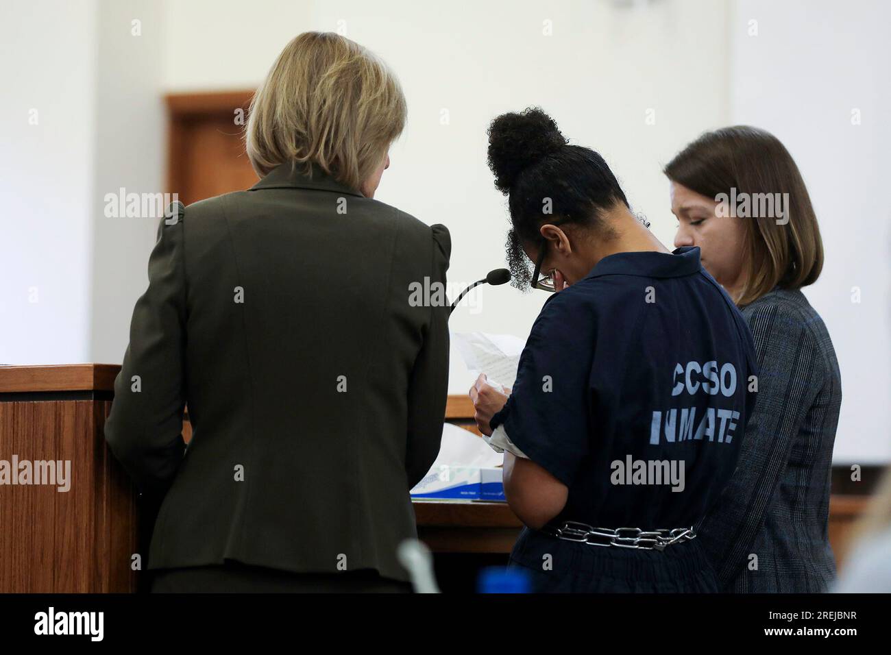 Elizabeth Archibeque reads a statement during her sentencing hearing in ...