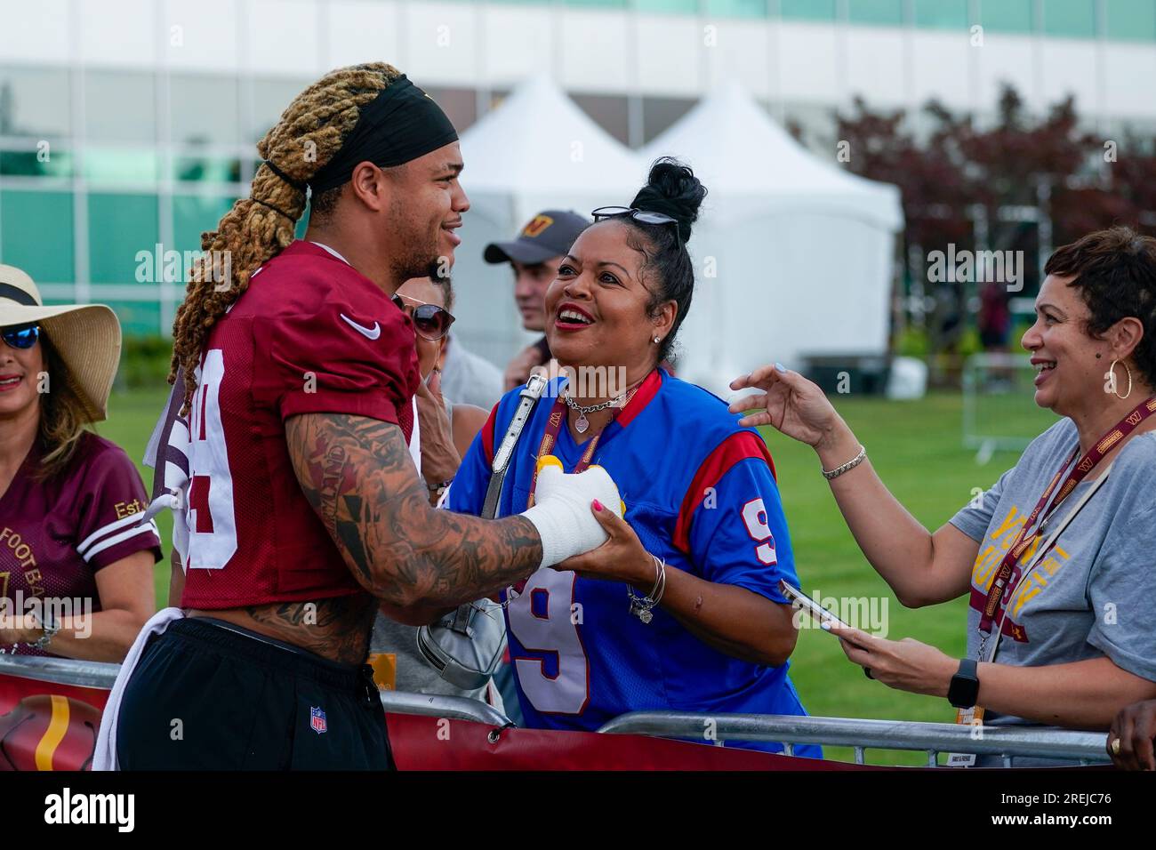 Washington Commanders defensive end Chase Young (99) greets his mom ...