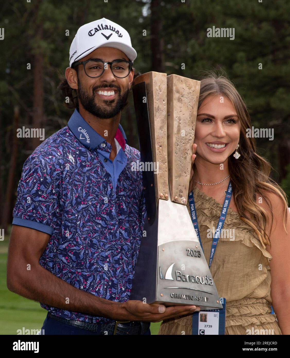 Akshay Bhatia holds the championship trophy with girlfriend Presleigh ...