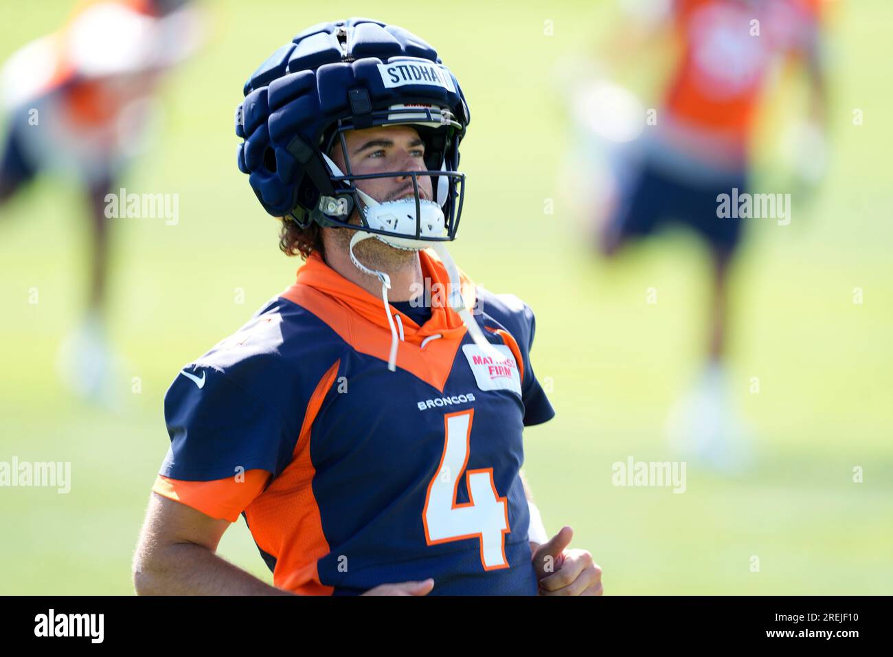Denver Broncos quarterback Jarrett Stidham (4) takes part in drills during an NFL football ...