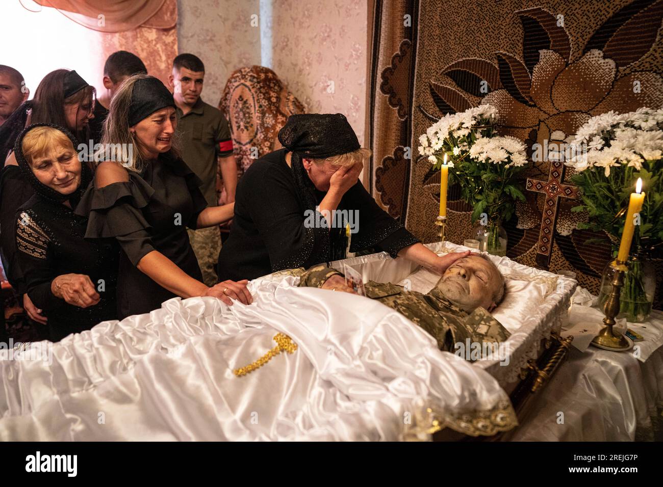 Myroslava cries over the body of her husband Stepan Tymchyshak, a ...