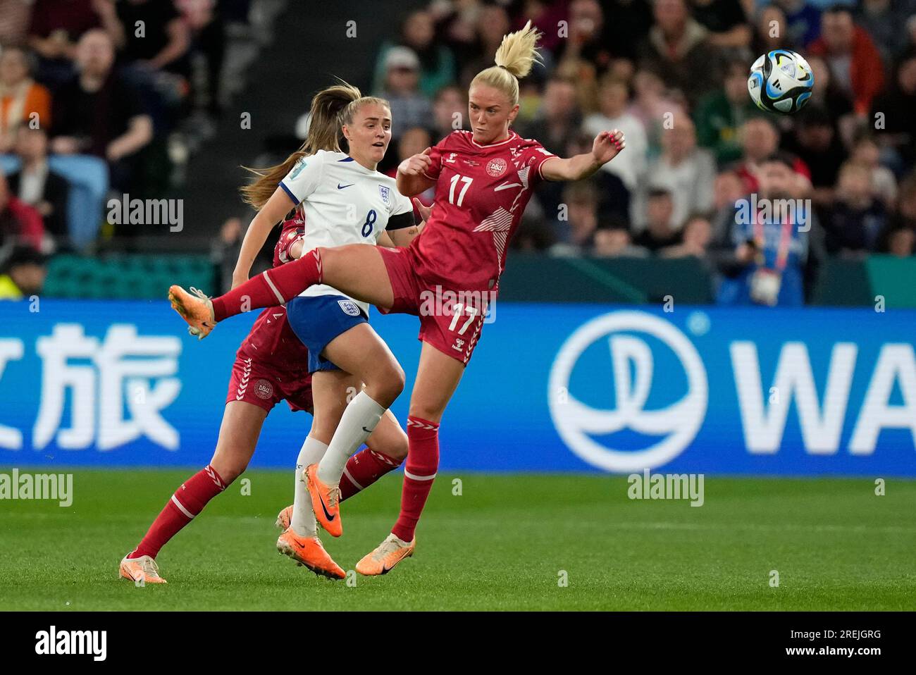 Denmark's Rikke Marie Madsen, right, battles for the ball with England ...