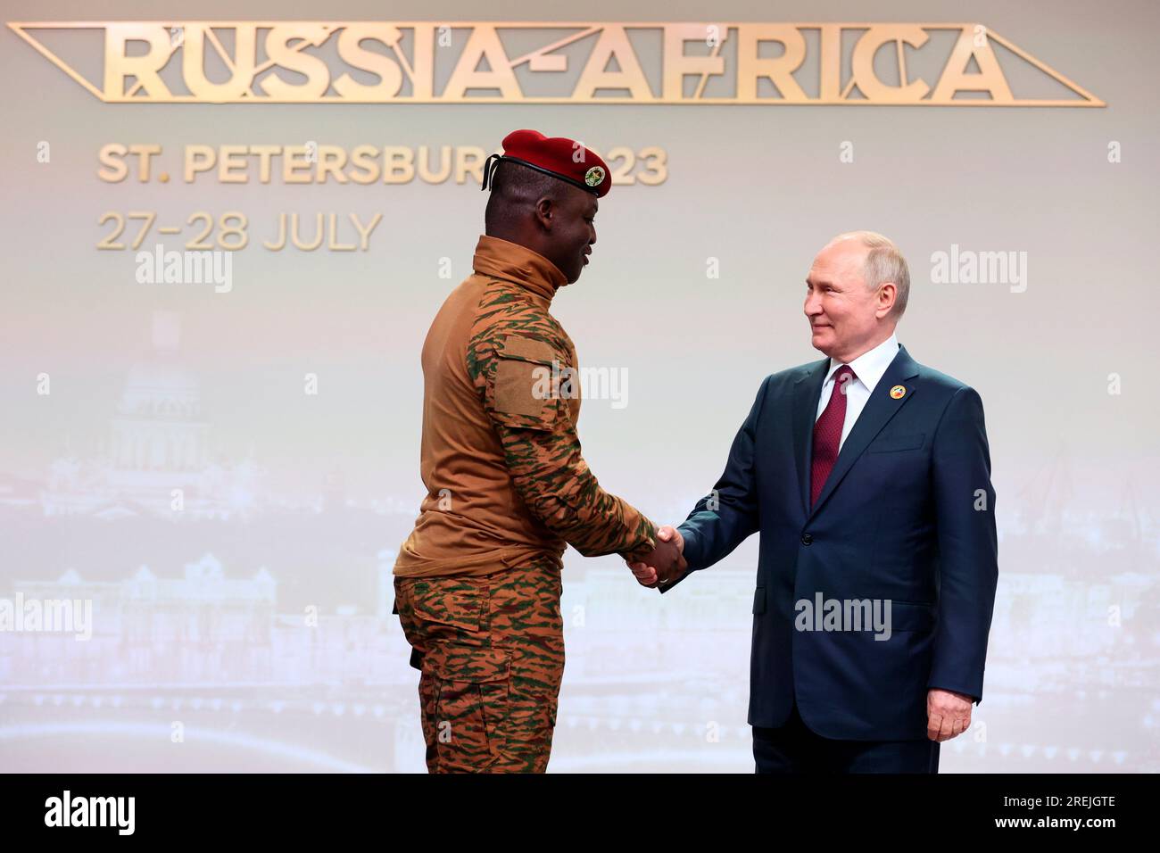 Burkina Faso's Capt. Ibrahim Traore, left, and Russian President Vladimir Putin shake hands ...
