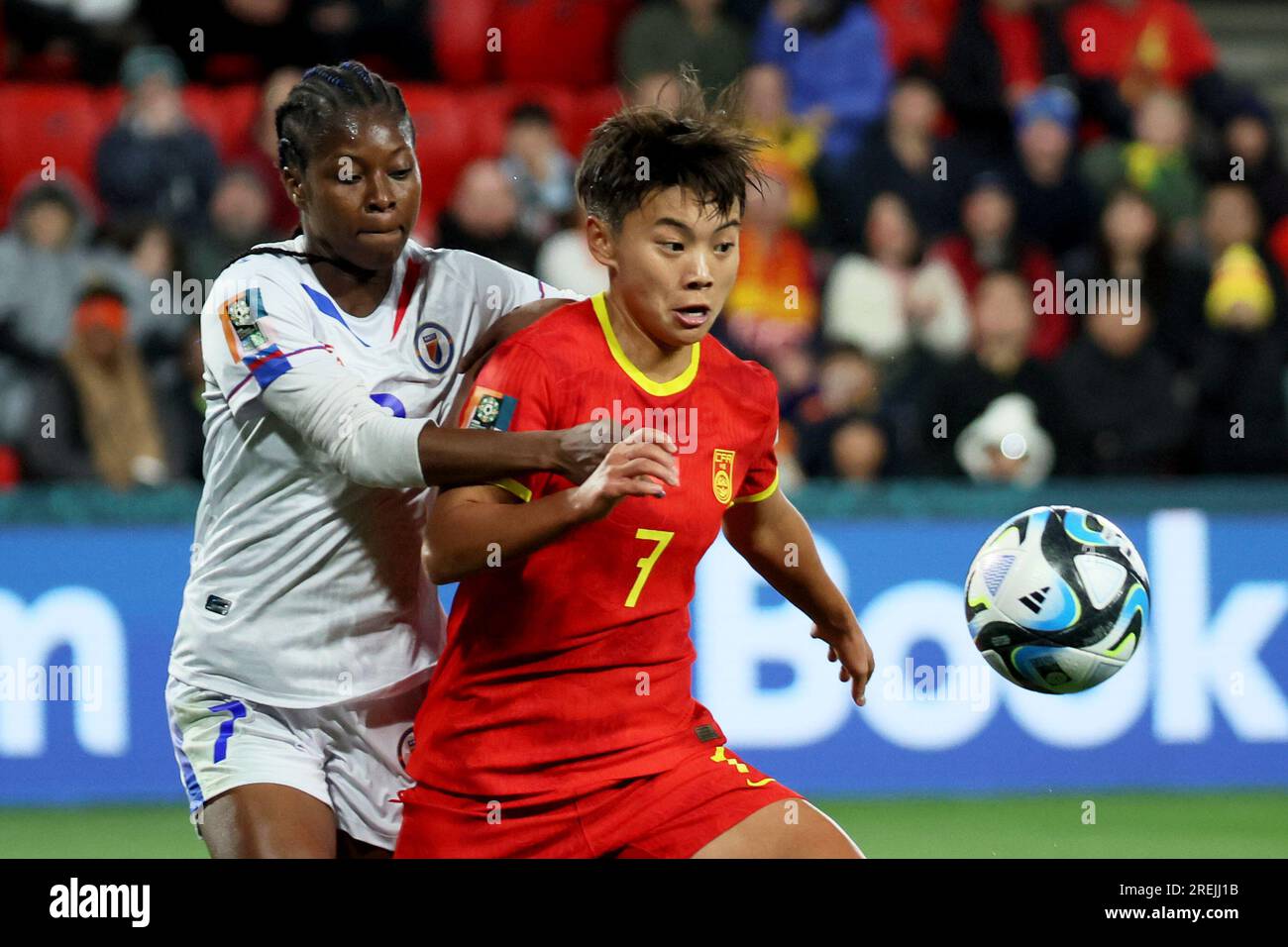 Haiti's Batcheba Louis, left, fights for the ball with China's Wang ...
