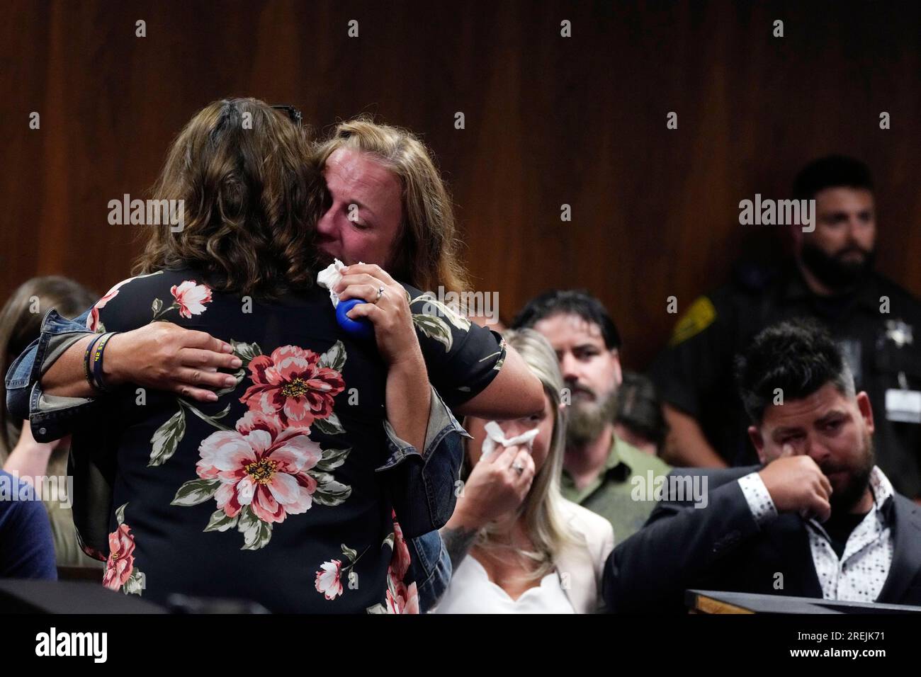Sheri Myre, background, mother of slain Oxford student Tate Myre, hugs ...