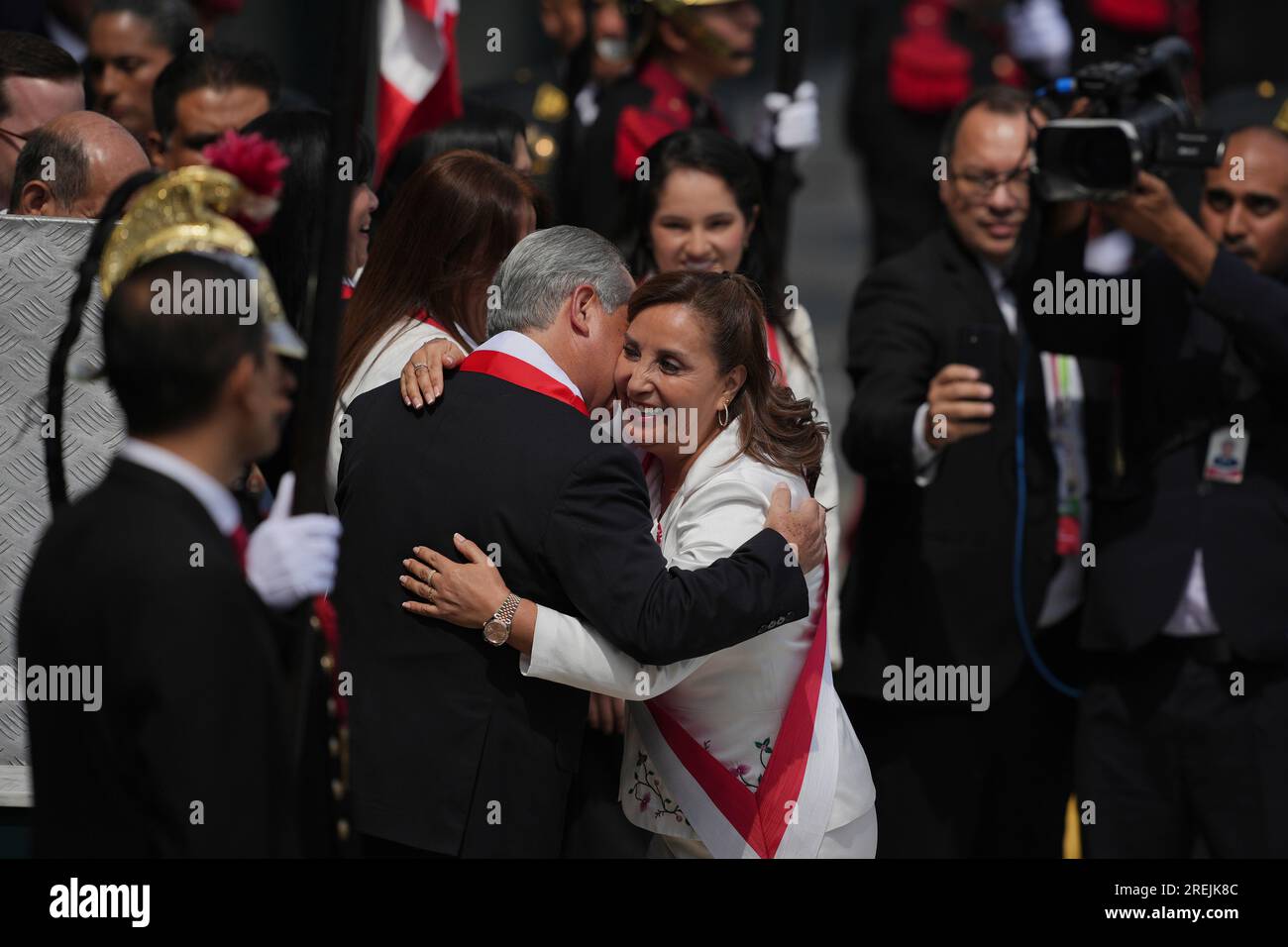 Peruvian President Dina Boluarte is embraced by lawmaker Miguel Siccia ...