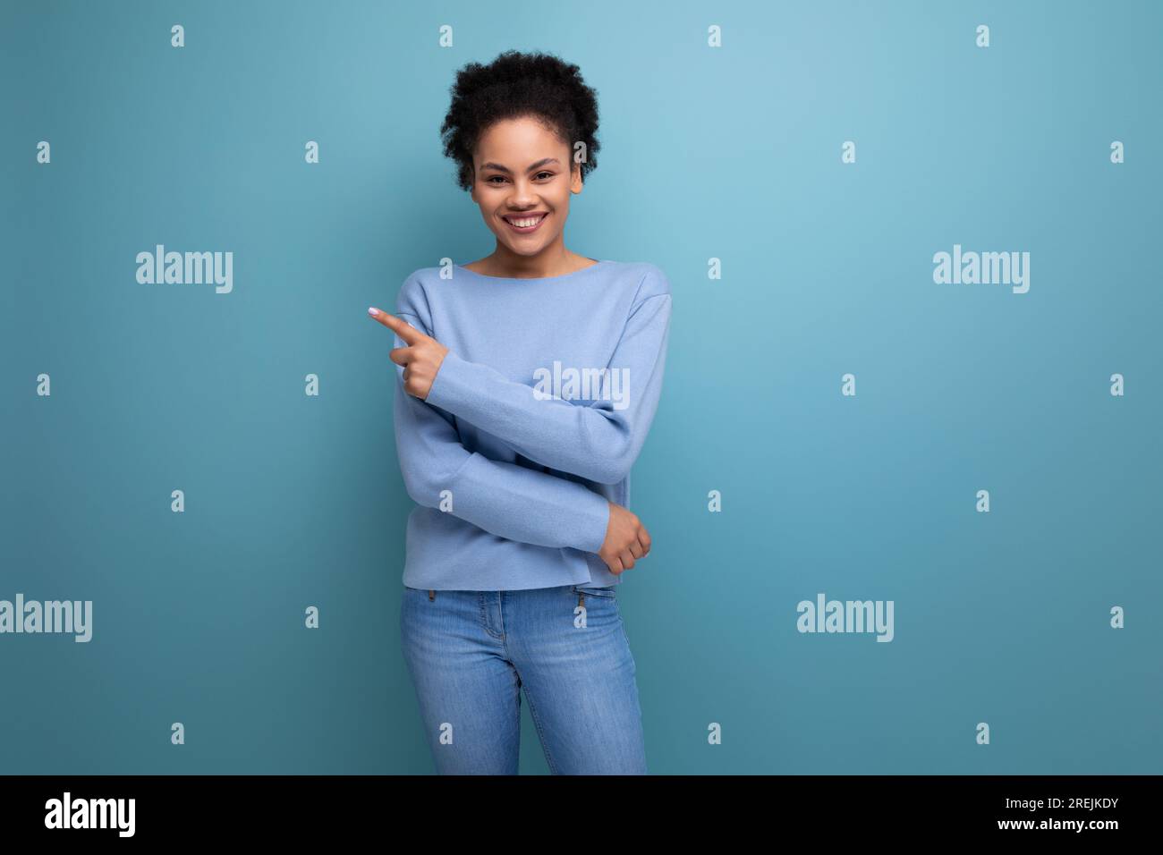 well-groomed cheerful young african 20s woman with curly hair gathered ...