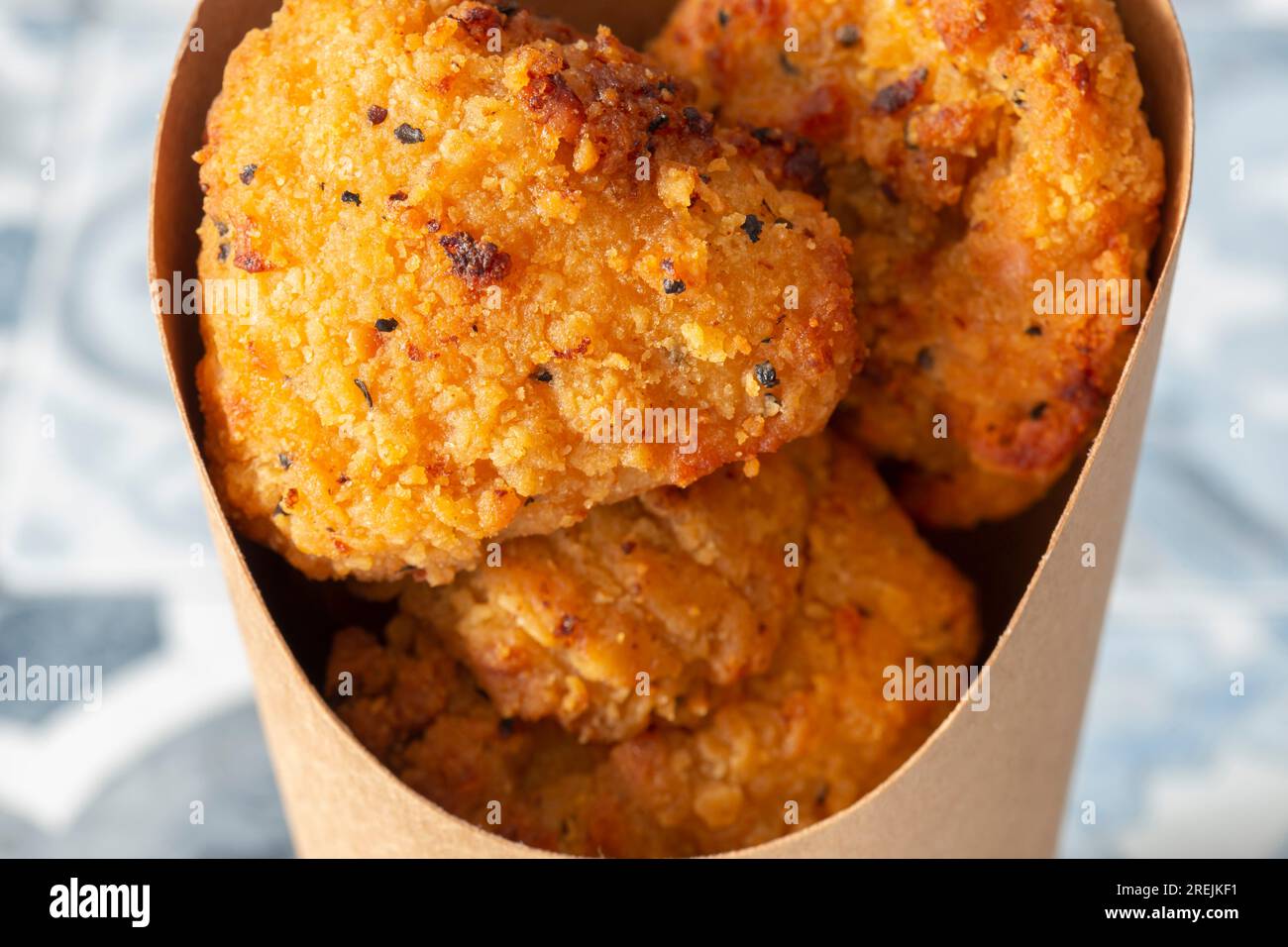 Southern fried chicken bites takeaway in a cardboard carton with a ...