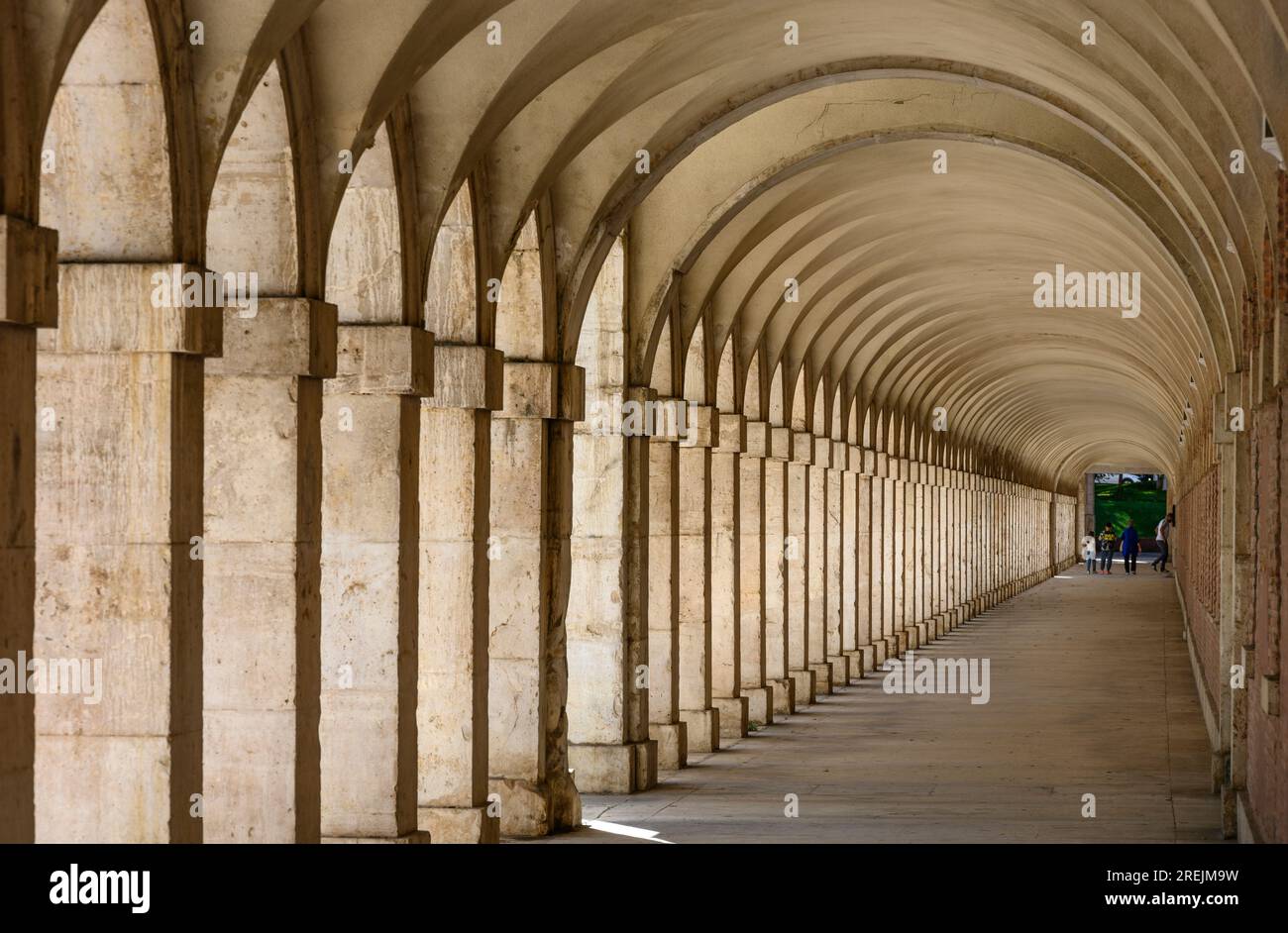 A colonaded walkway attached to the side of The Royal Palace at ...