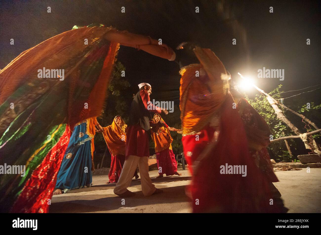 Group of indian womans wearing colorful saris performing a traditional ...
