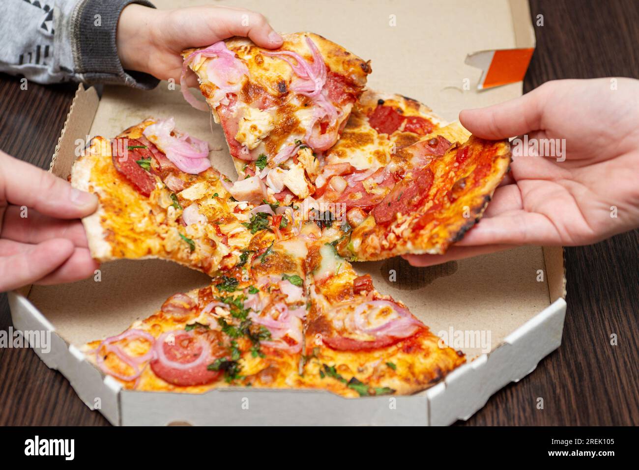 Hands grabbing slices cheese pizza hi-res stock photography and images ...