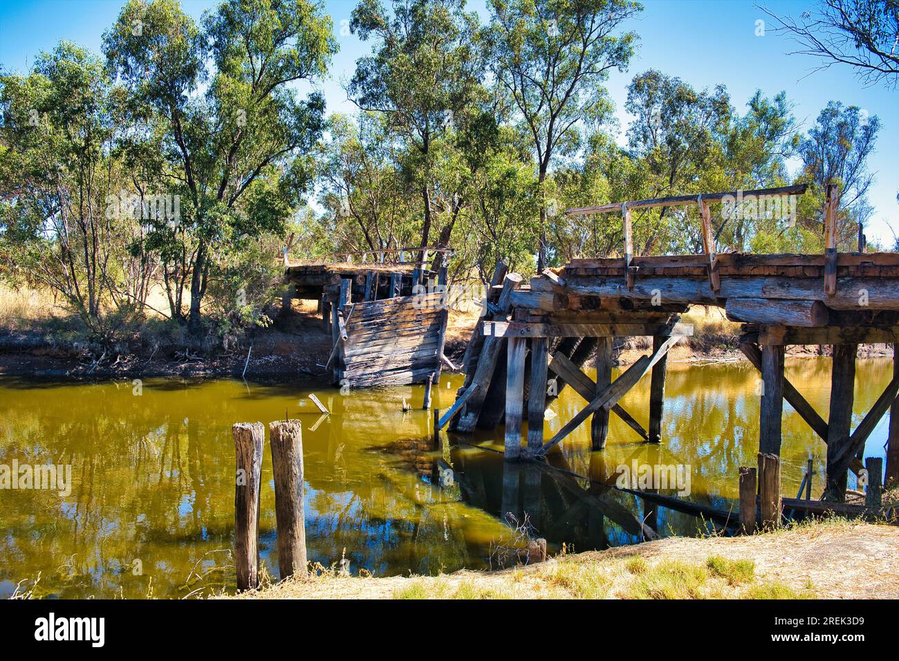 The collapsed old wooden Pumphrey's Bridge over the Hotham River, shire ...
