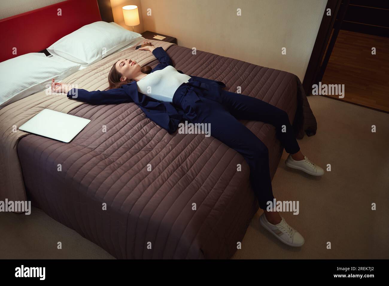 Woman resting after work in the hotel room Stock Photo - Alamy