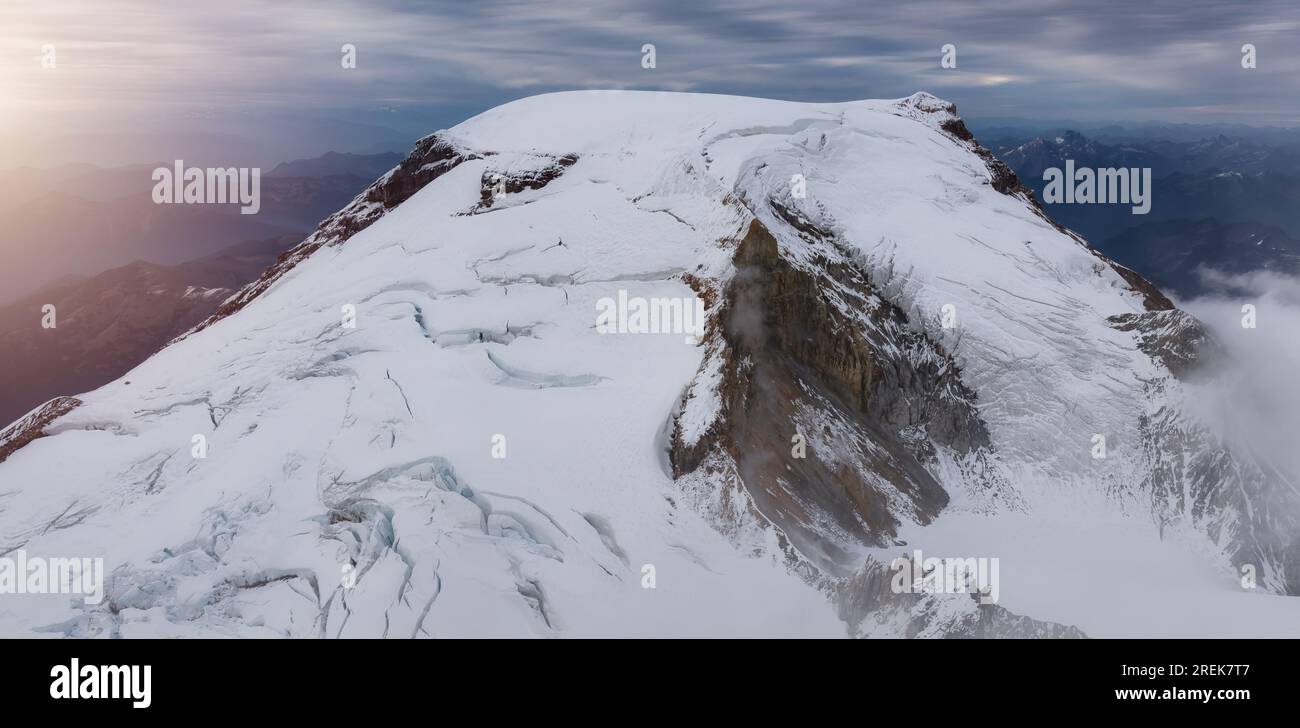 Mt Baker covered in snow and clouds. Aerial landscape nature background ...