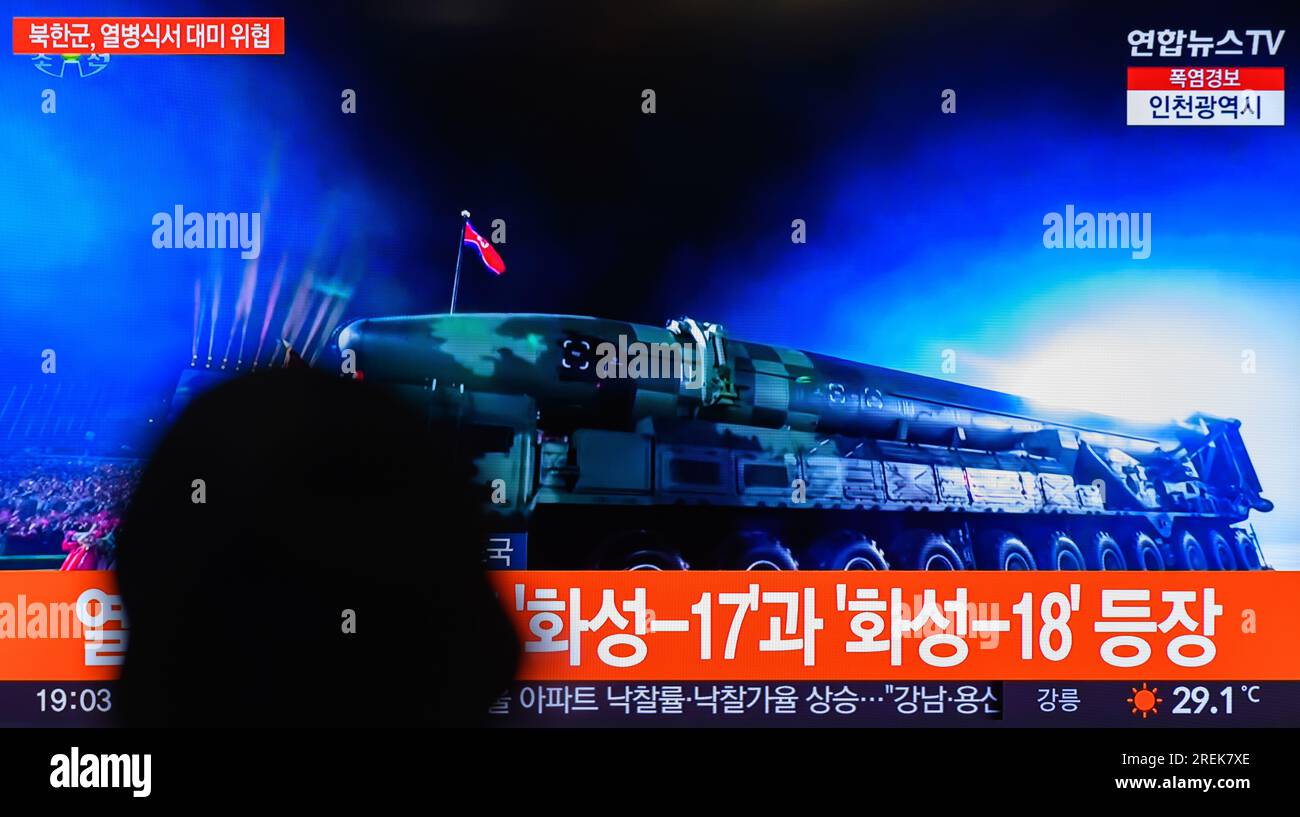 A TV screen shows an image of liquid-fuel Hwasong-17 intercontinental ...