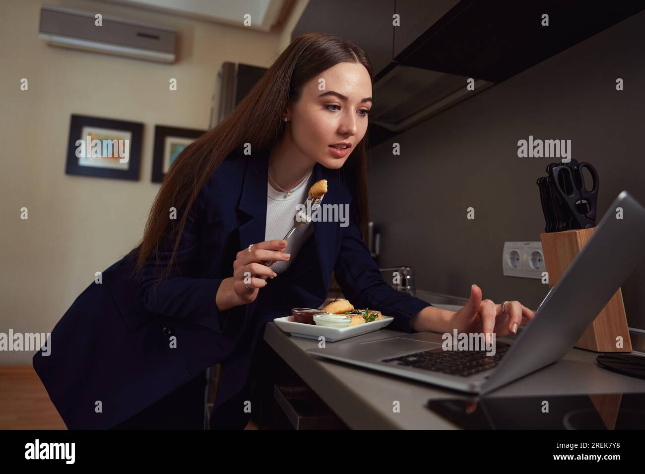 Female having breakfast and watching movie in the hotel Stock Photo - Alamy