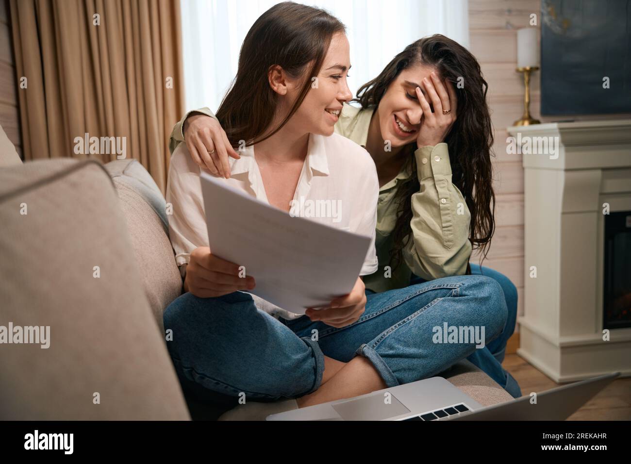 Smiling pretty women doing paperwork or studying Stock Photo - Alamy