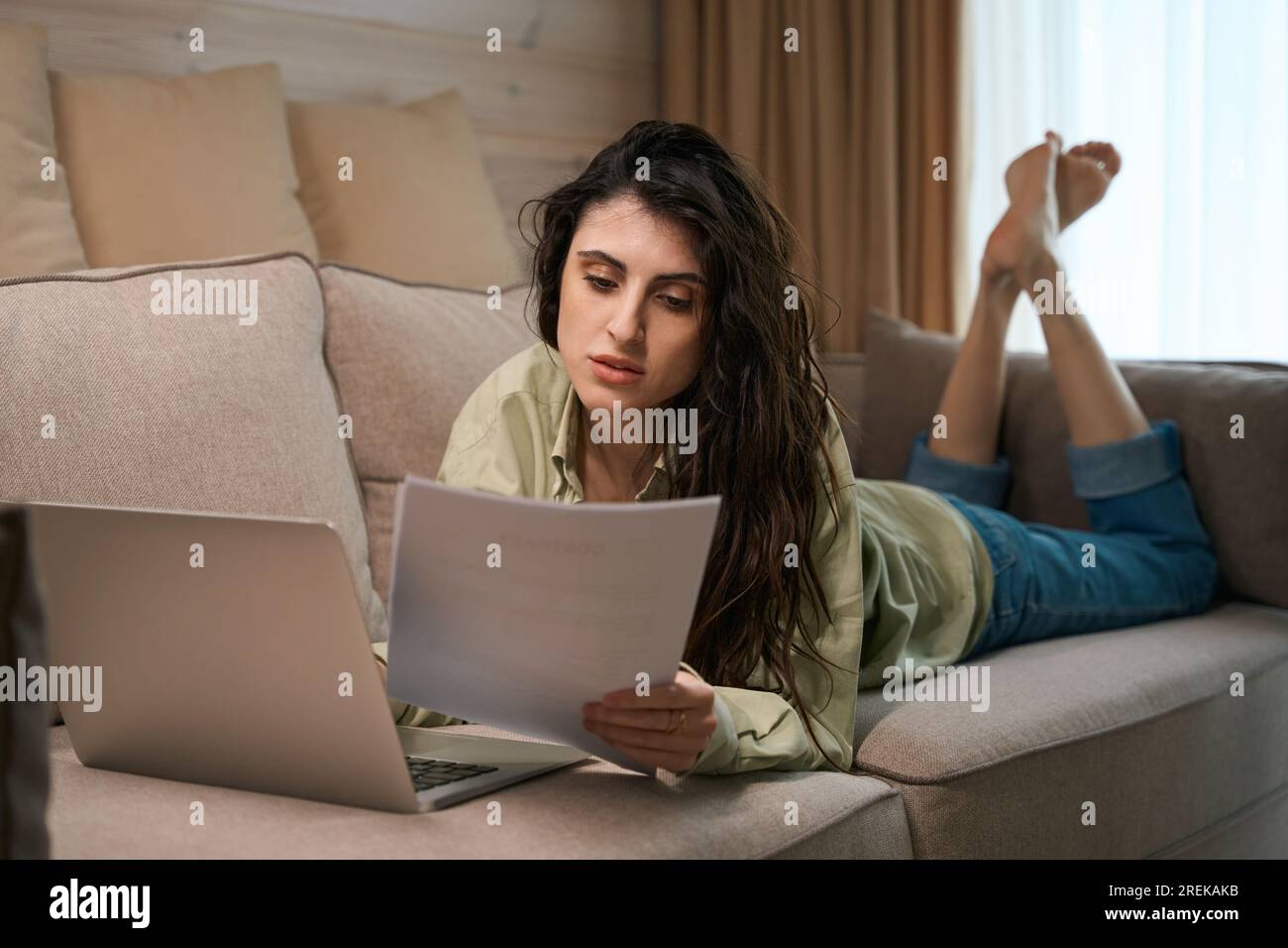 Concentrated pretty woman doing paperwork or studying Stock Photo - Alamy