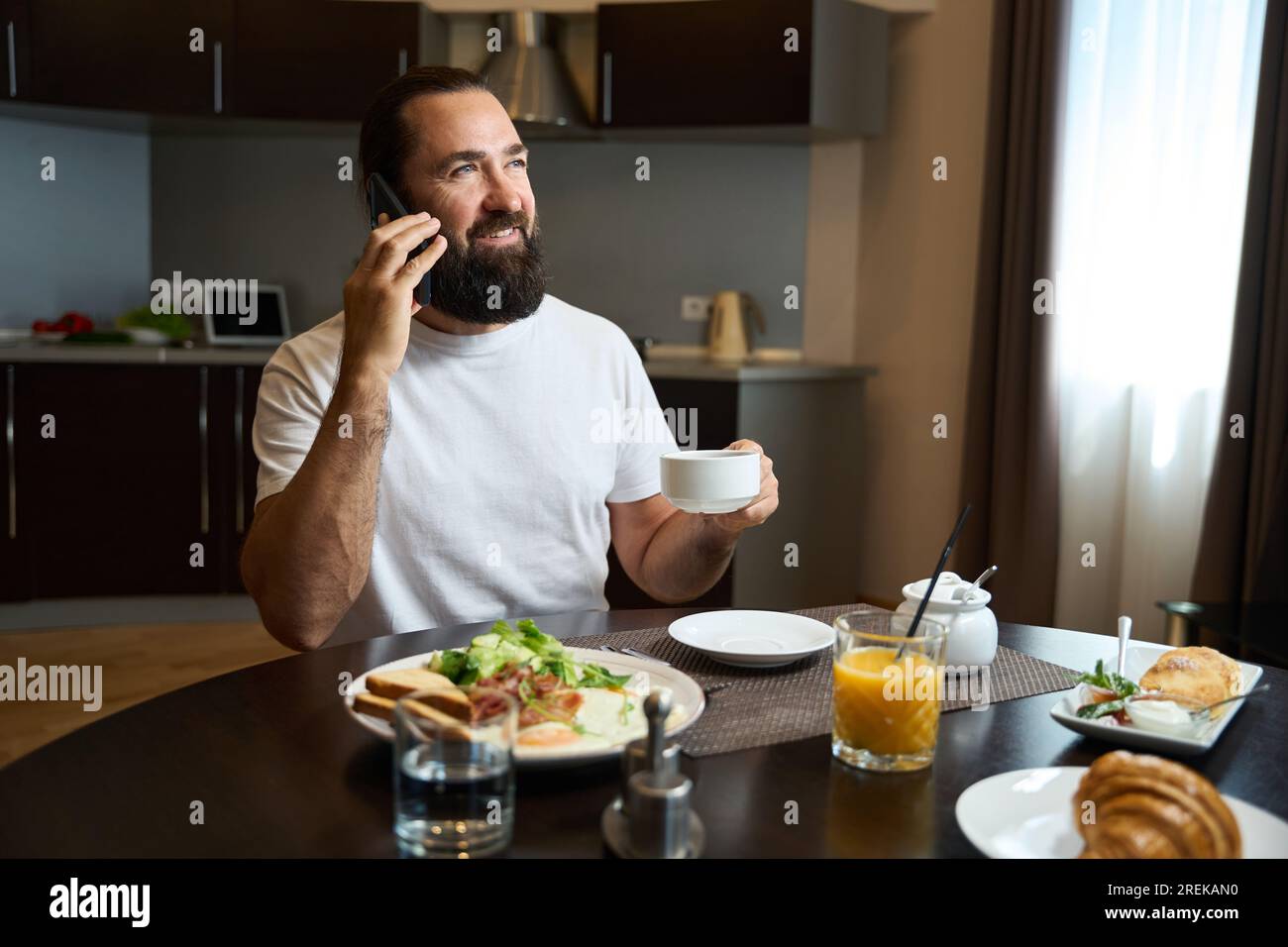 Man enjoys coffee talking hi-res stock photography and images - Alamy