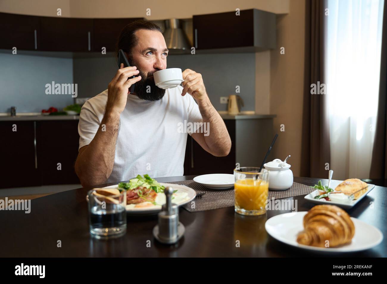 Man enjoys coffee talking hi-res stock photography and images - Alamy