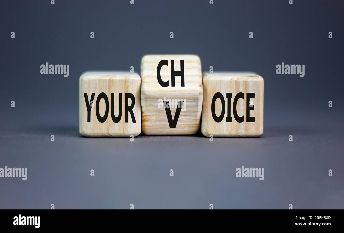 Your voice choice symbol. Businessman turns wooden cubes and changes ...