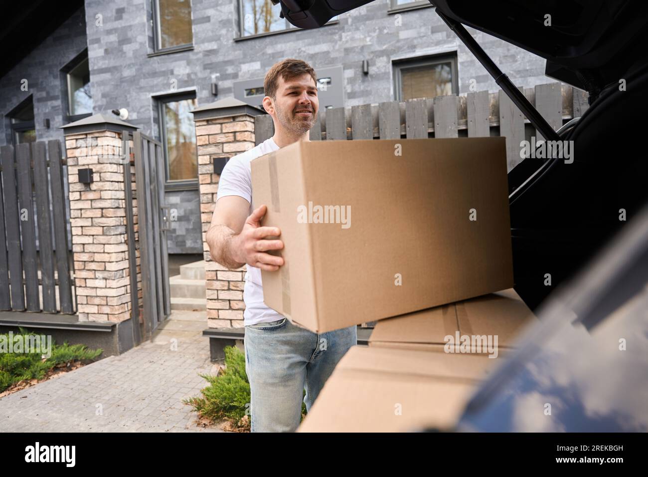 Young man takes out box hi-res stock photography and images - Alamy