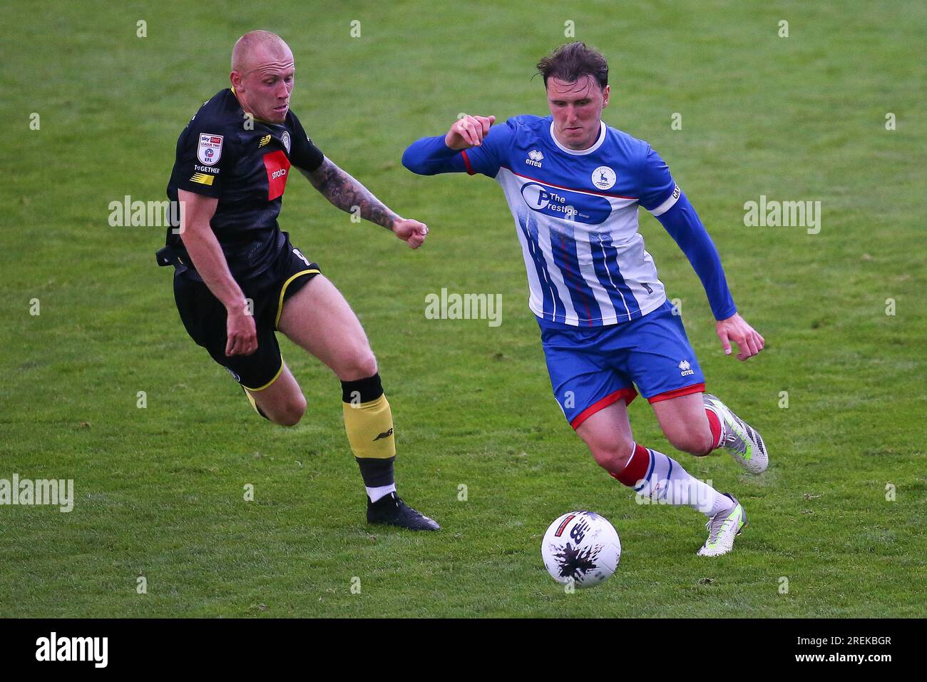 Hartlepool United's Callum Cooke goes past Harrogate Town's Dean ...