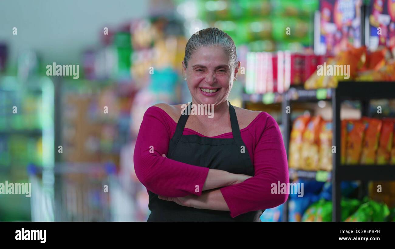 Joyful female grocery store worker hi-res stock photography and images ...