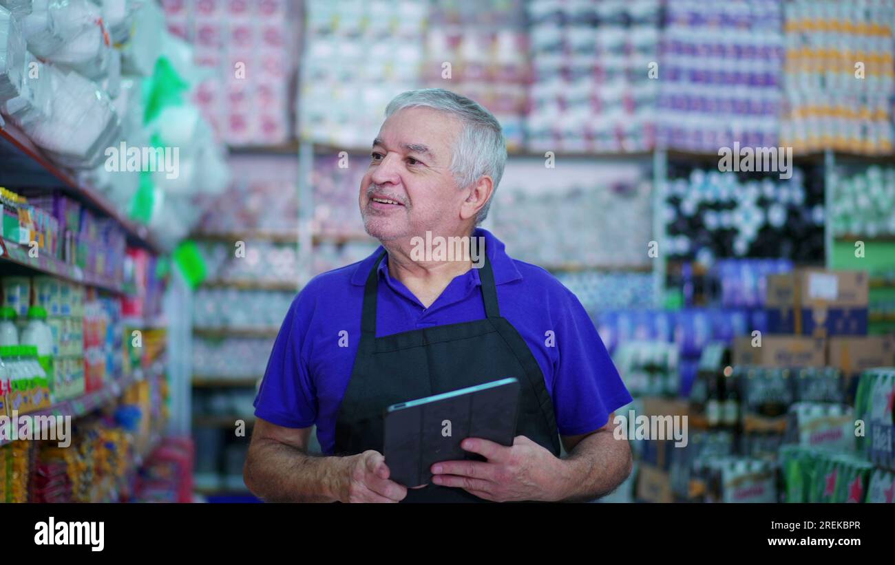 Joyful Senior Grocery Store Manager Checking Product Inventory on Shelf ...