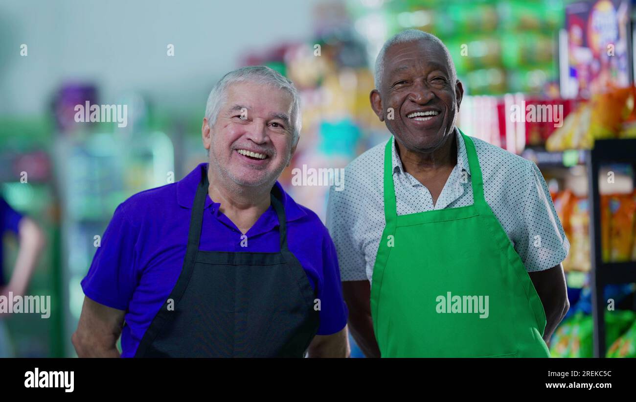Happy diverse senior employees celebrating success with high-five ...