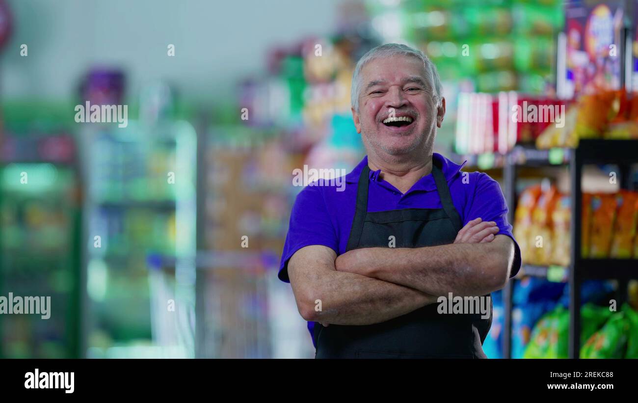 Happy older worker staff laughing hi-res stock photography and images ...