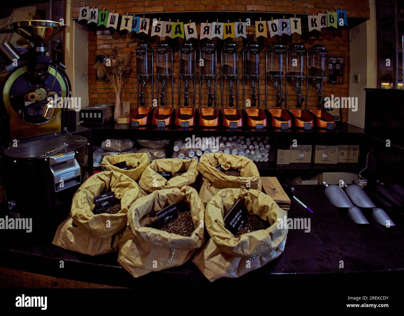 Bags with different types of coffee on a table in a coffee shop. You ...