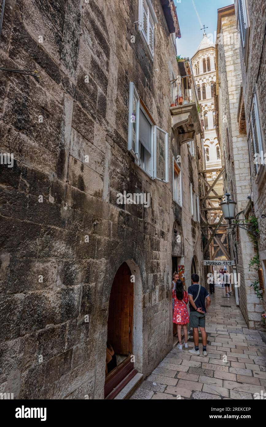 visitors exploring the old town area in grad split croatia. tourists ...