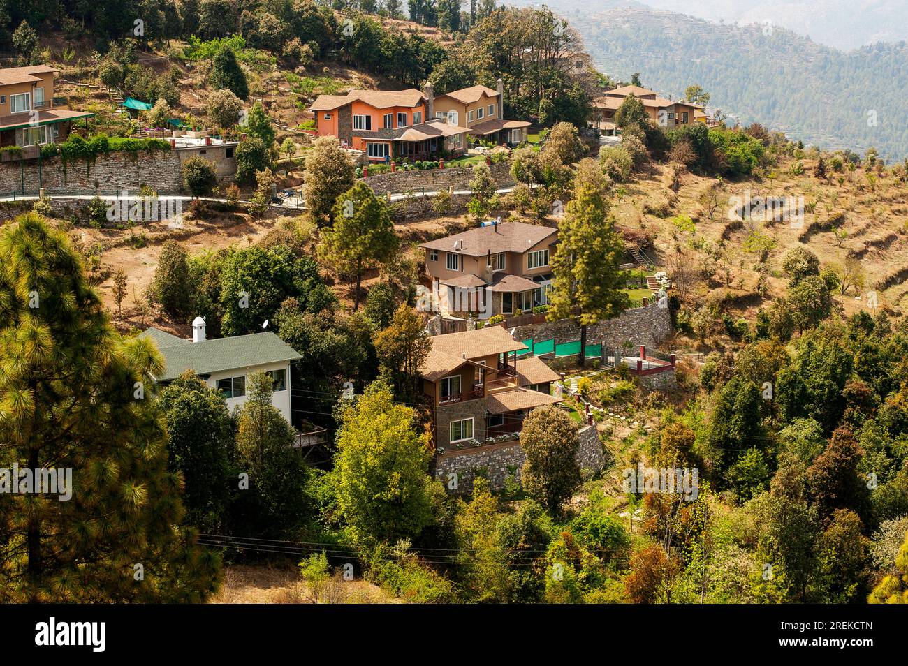 Small village on the Kumaon Hills, terraced fields can be seen around ...