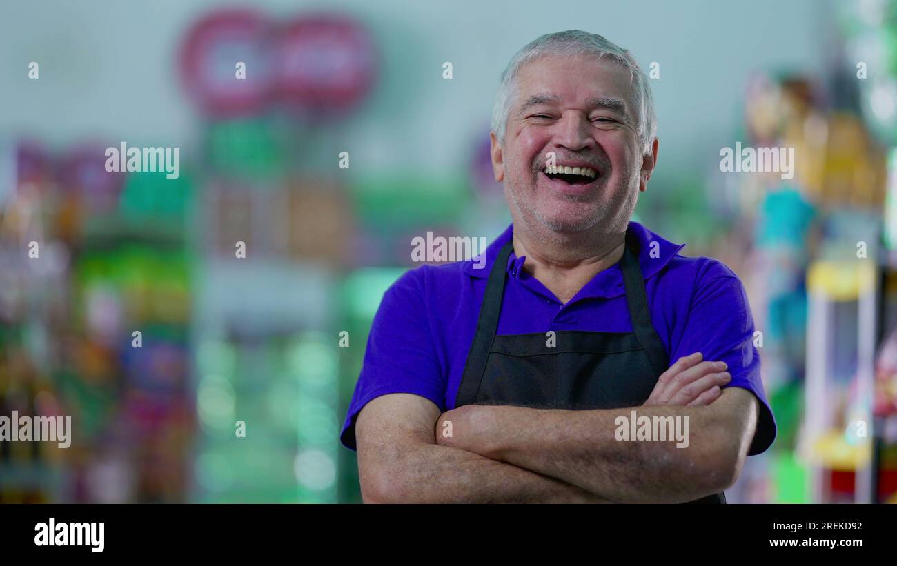 Cheerful Older Worker Staff Laughing and Smiling in Supermarket Grocery ...