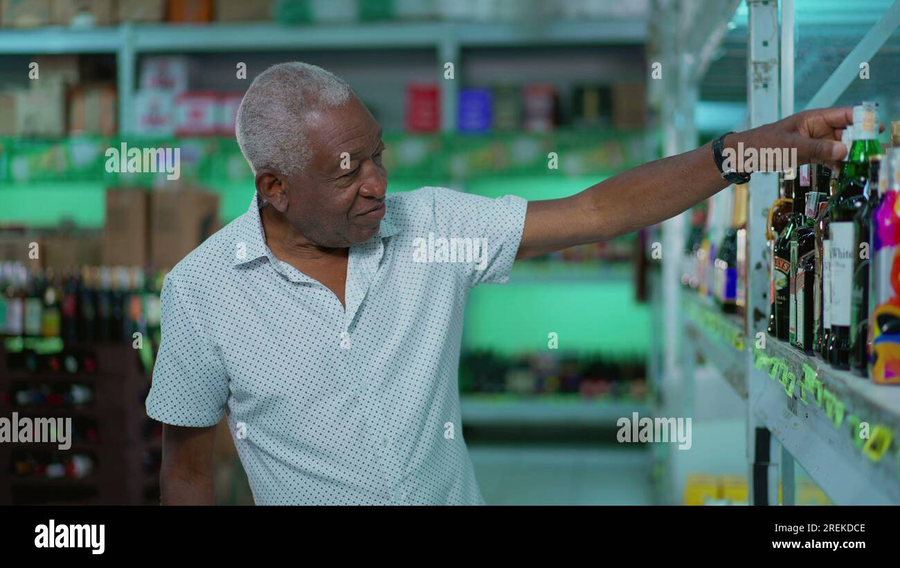 Elderly African American Man Selecting Alcoholic Beverages at ...
