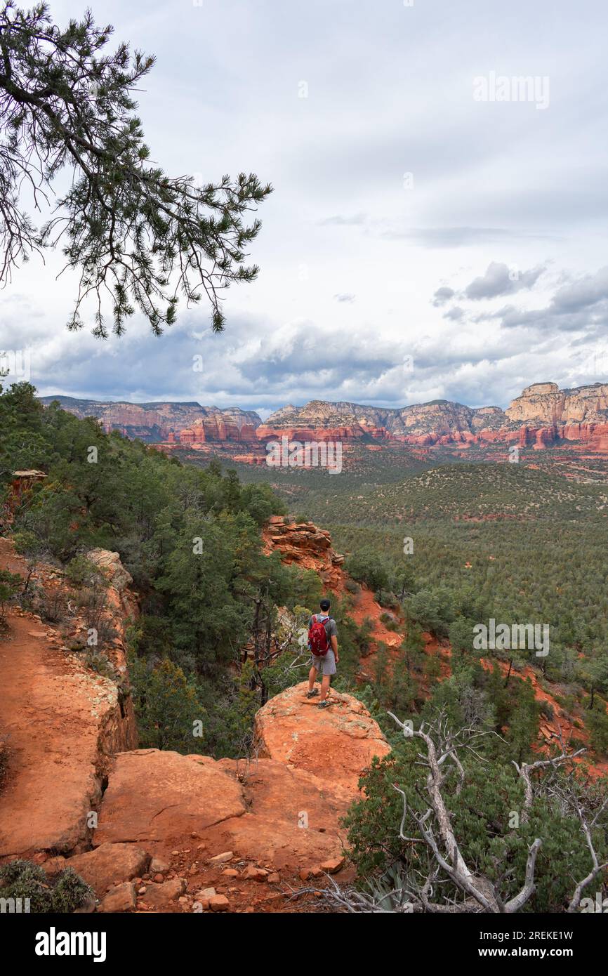 Hiker enjoying the vast beauty of Sedona's red rock landscape Stock ...